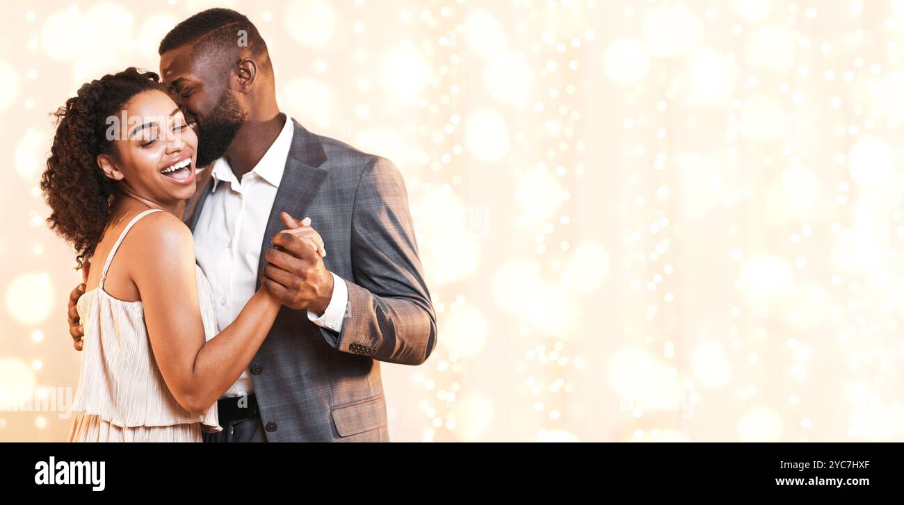 Beautiful happy black couple dancing in modern restaurant Stock Photo ...