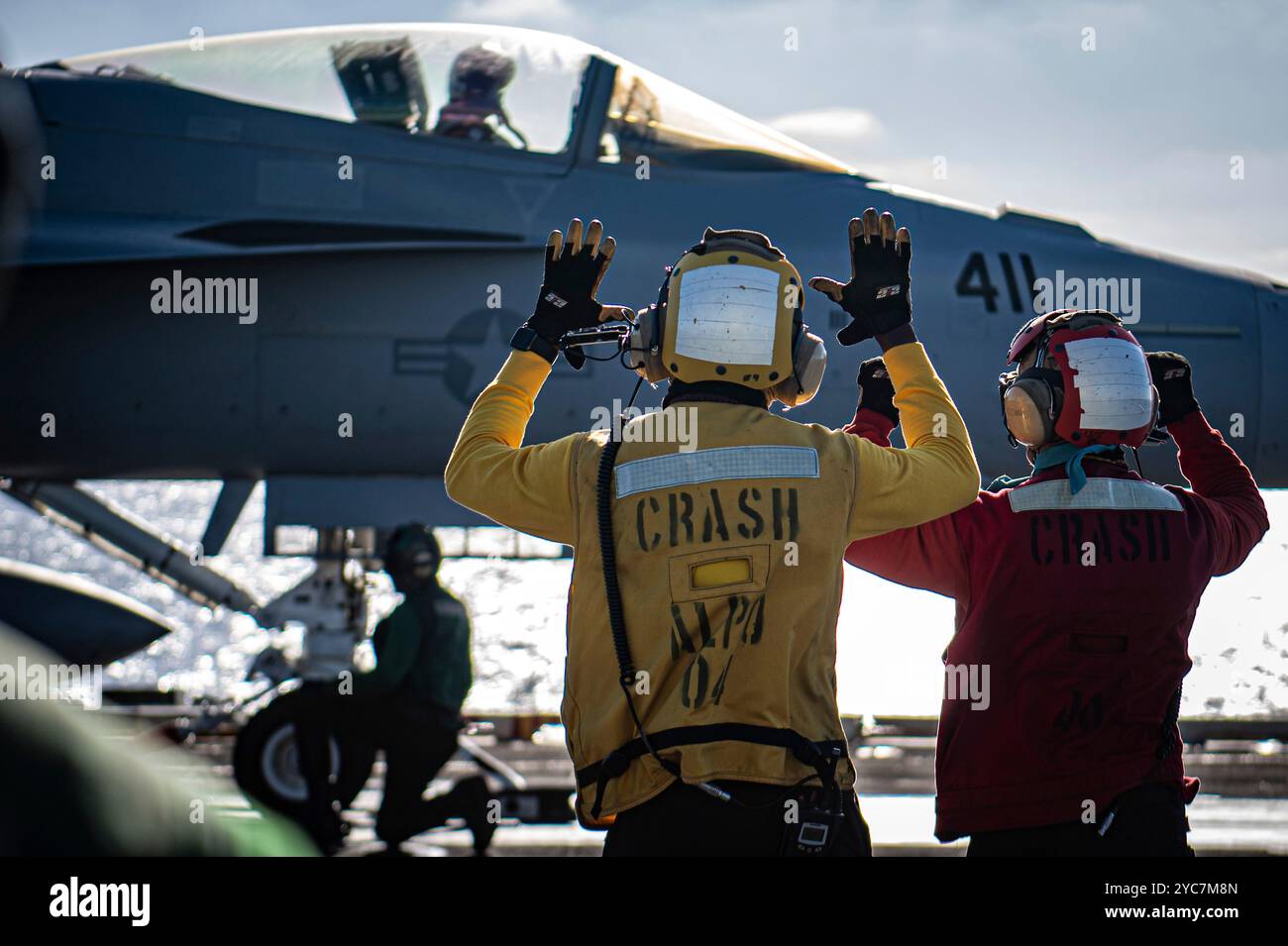 USS Nimitz, United States. 11 October, 2024. U.S. Navy sailors signal ...