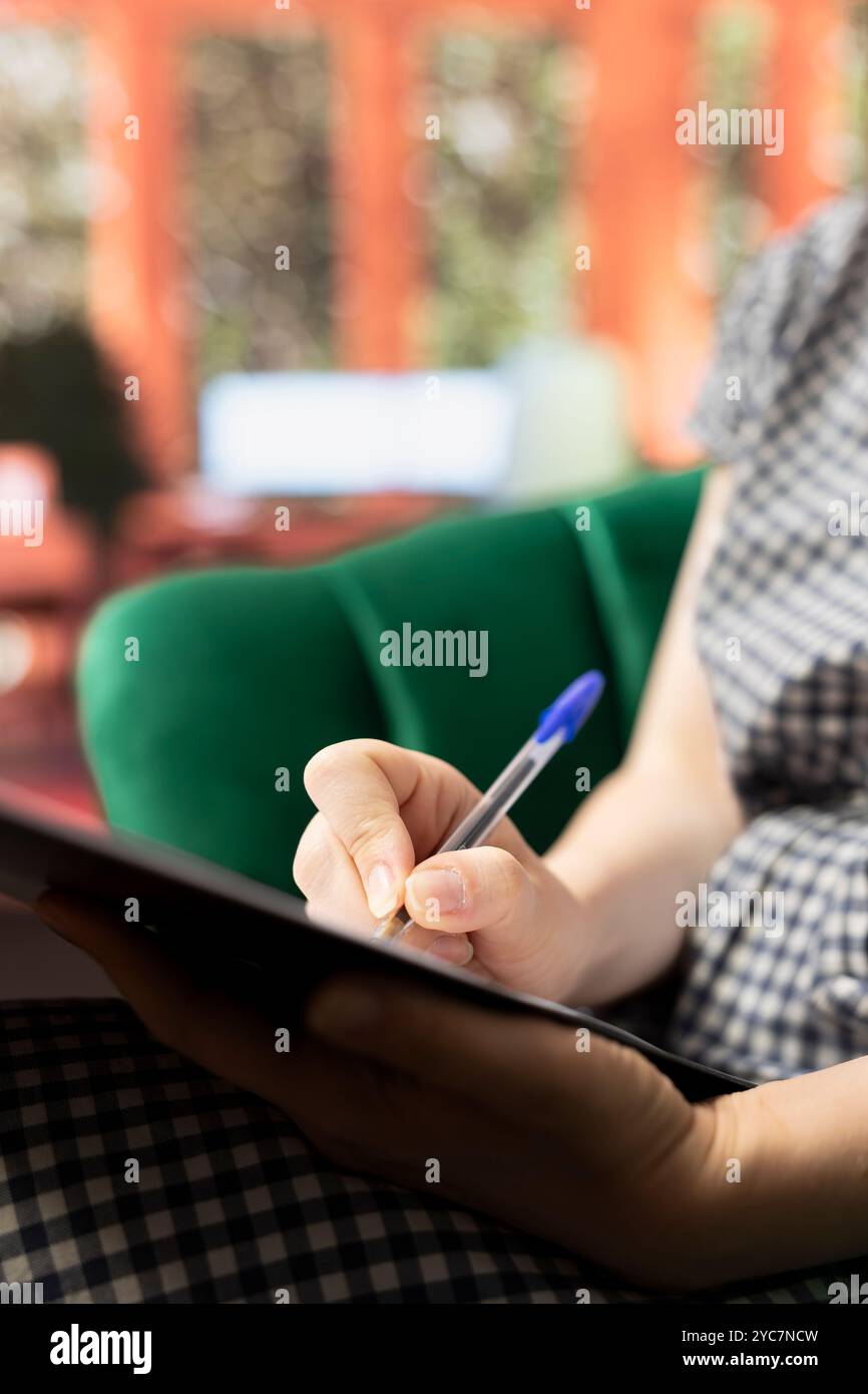 Psychology expert writing the progress of a client during therapy ...