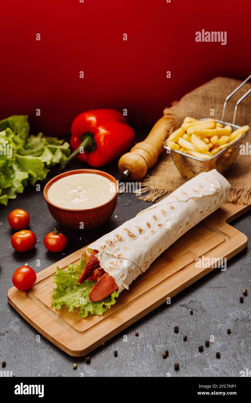 Grilled sausage wrap with fresh lettuce, a perfect quick snack or meal ...