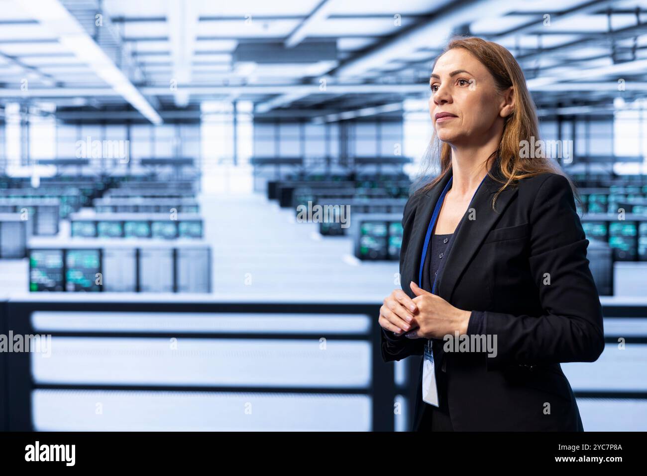 Employee in server hub using augmented reality to monitor energy ...