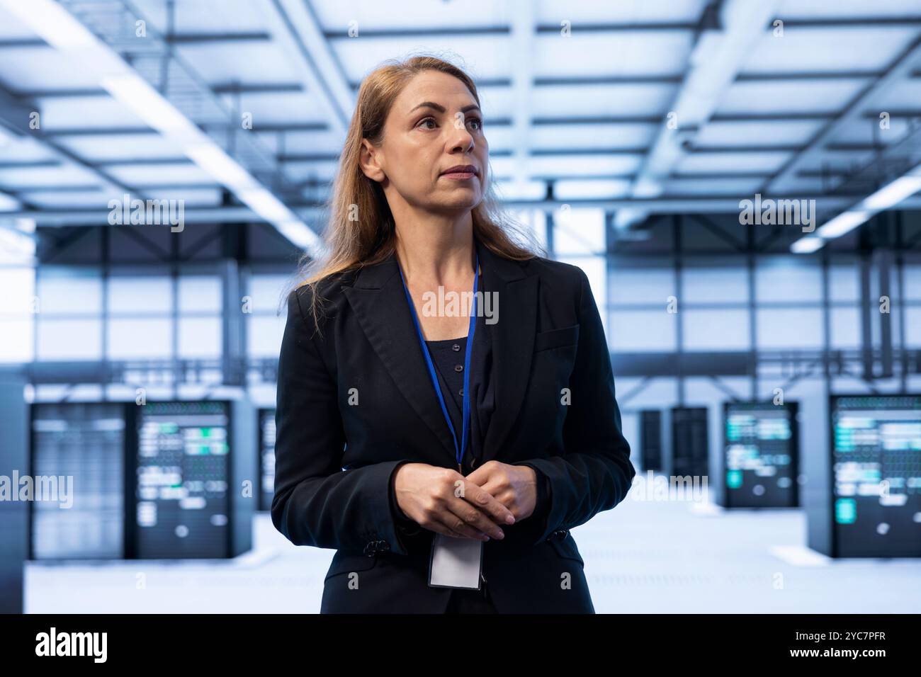 Computer scientist in data center identifying and solving technical issues related to data ...