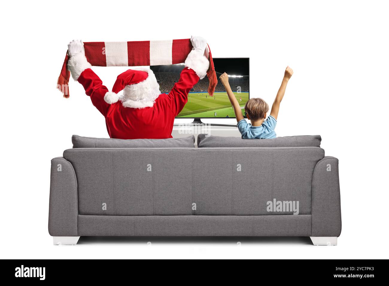 Santa claus and a boy cheering on a sofa and watching a football match ...