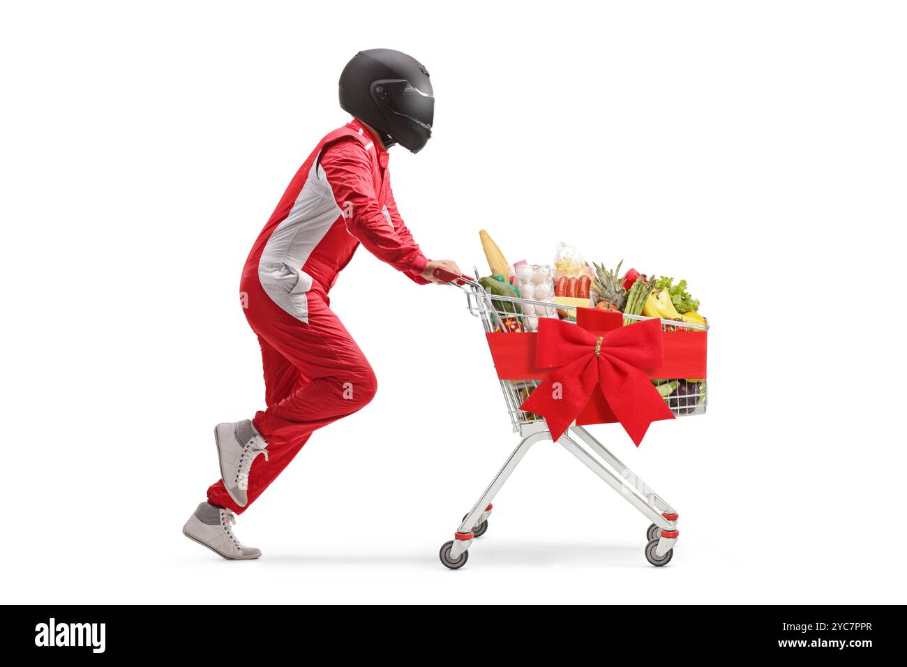 Racer in a suit and helmet running with a shopping cart with groceries ...