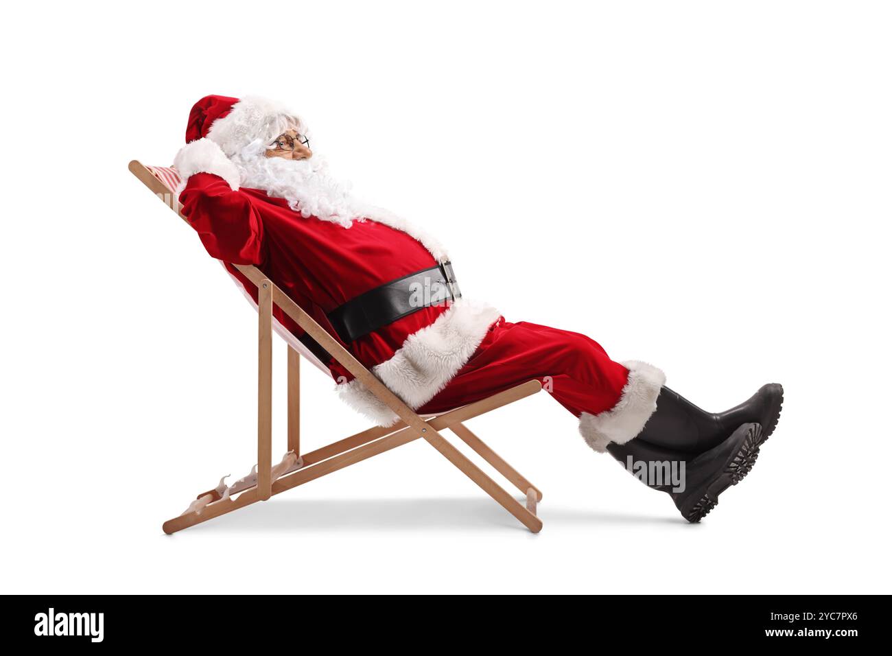 Santa claus on a summer vacation sunbathing in a beach chair isolated ...