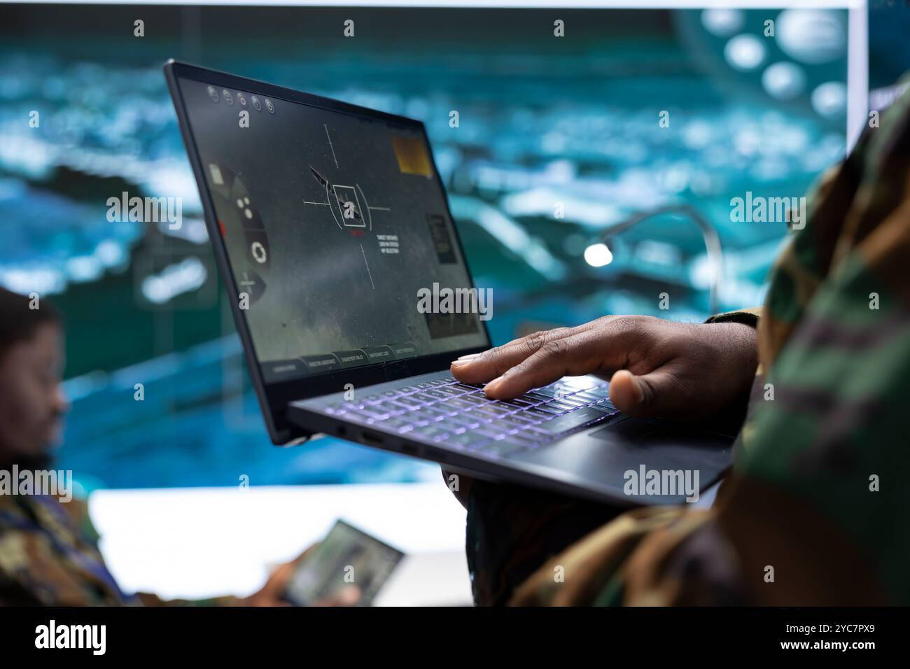 Intelligence specialist monitoring a world map and surveillance imagery ...