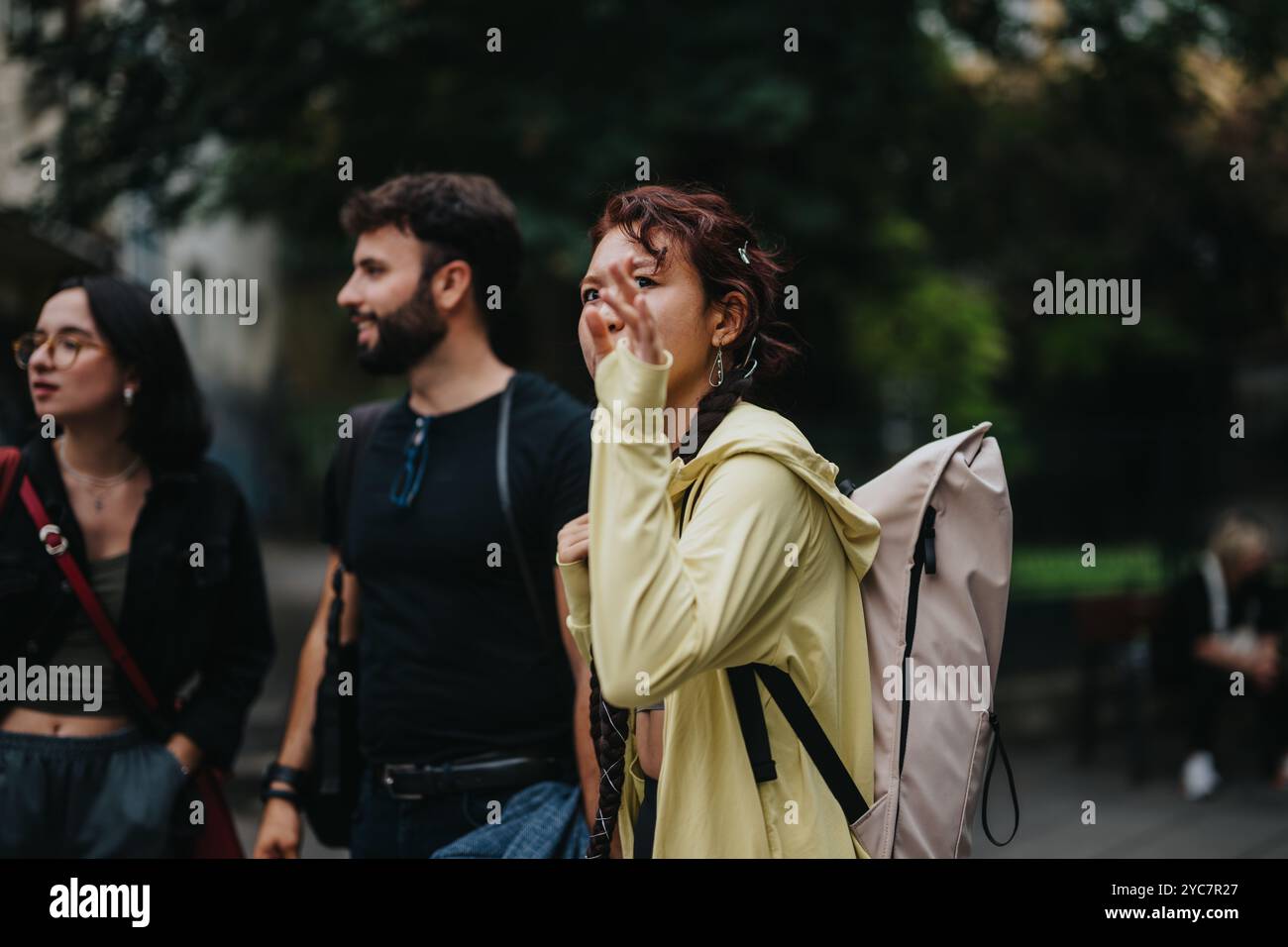 Group of young students exploring urban surroundings together outdoors ...