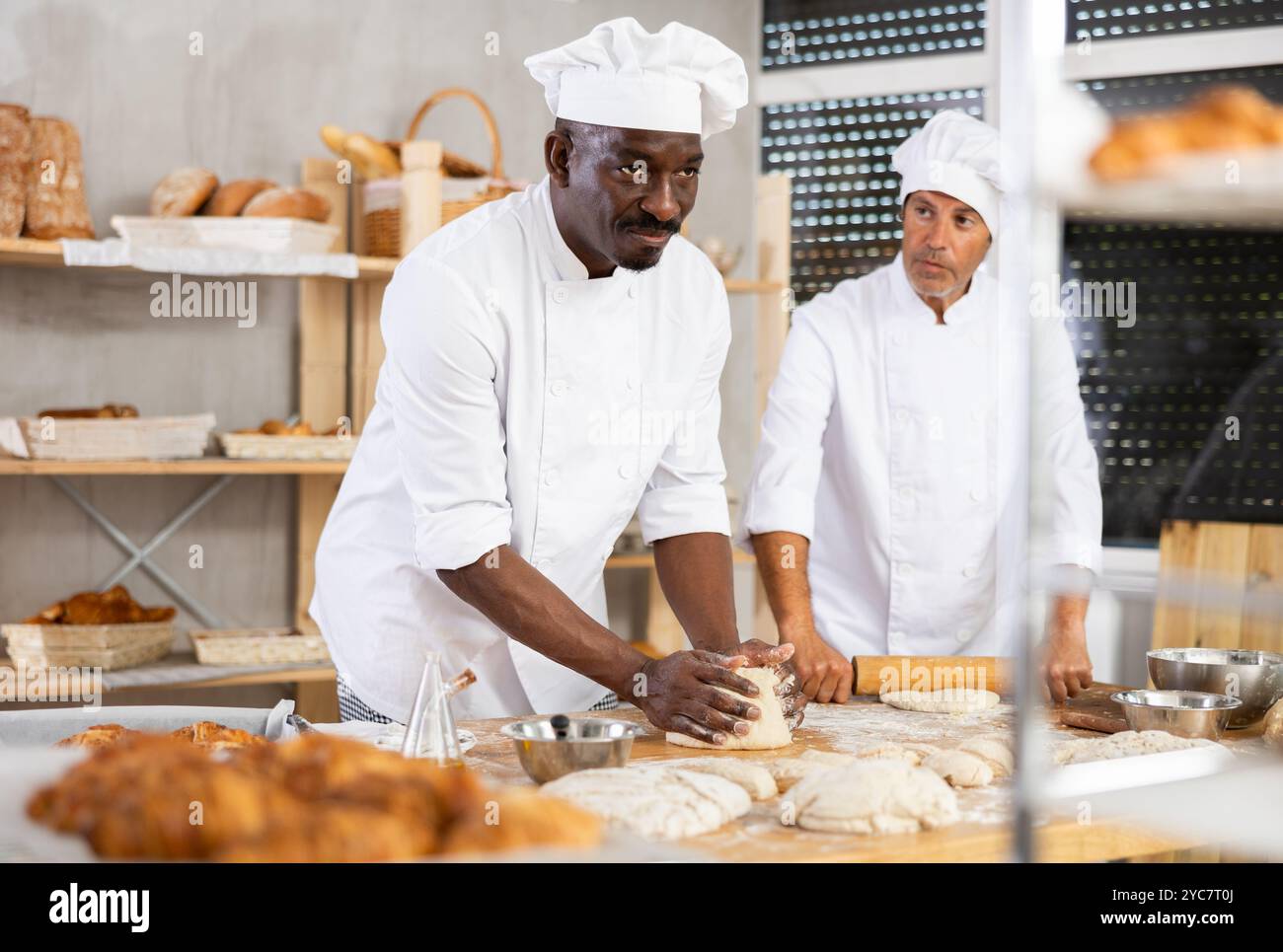 African american baker kneading hi-res stock photography and images - Alamy