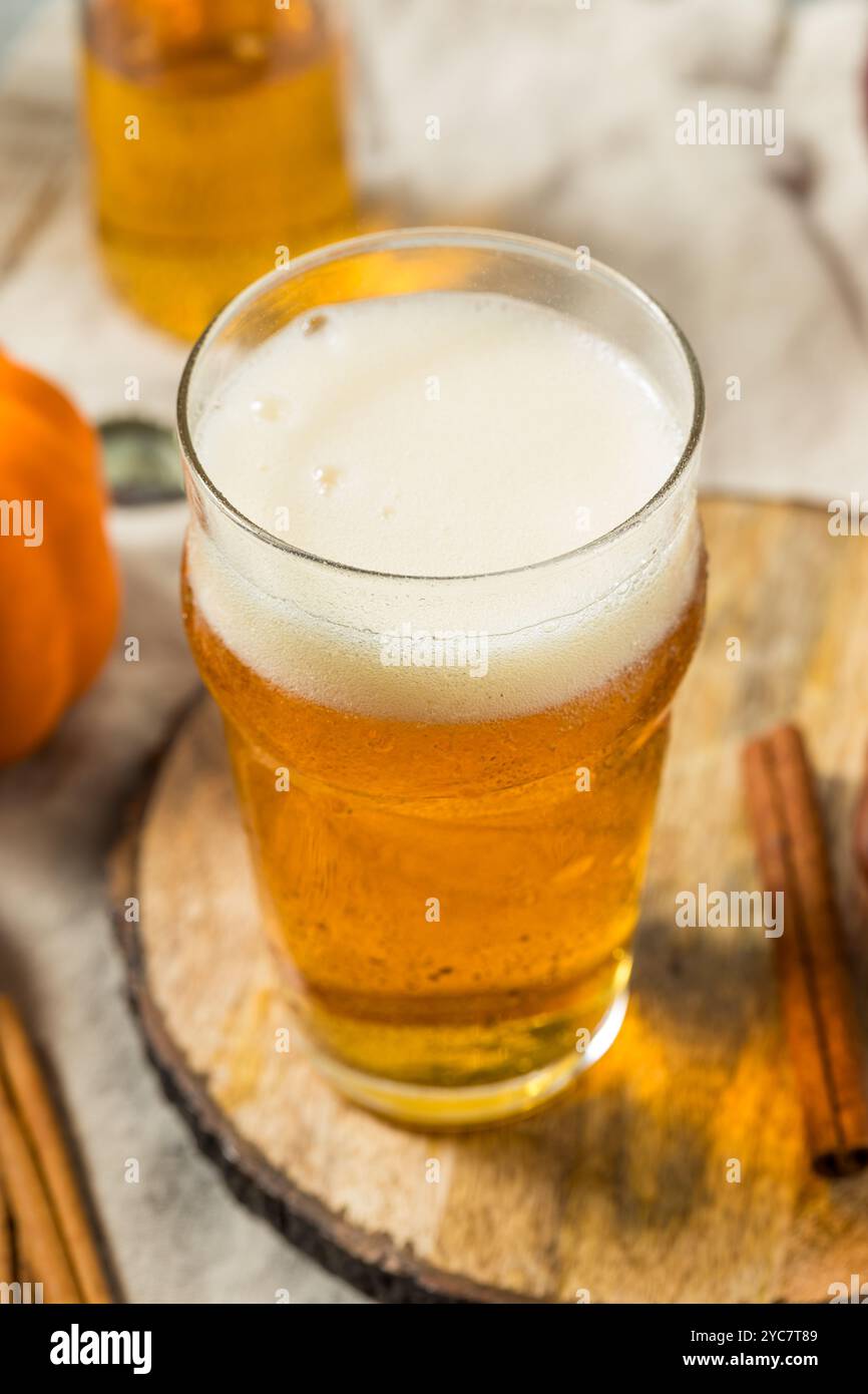 Cold Autumn Hard Pumpkin Apple Cider in a Pint Glass Stock Photo - Alamy
