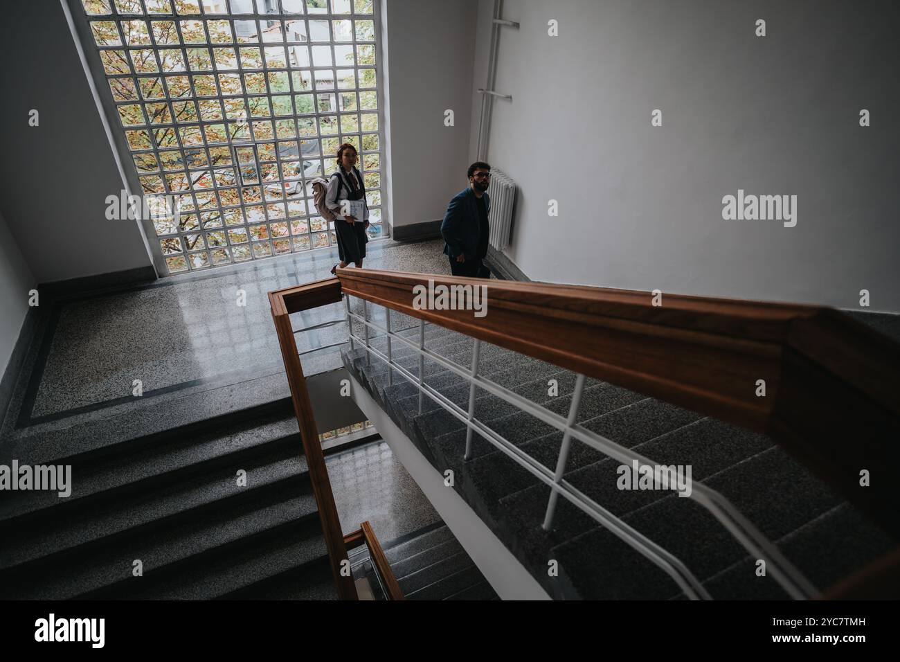 Students walking up the staircase in a modern university building Stock ...