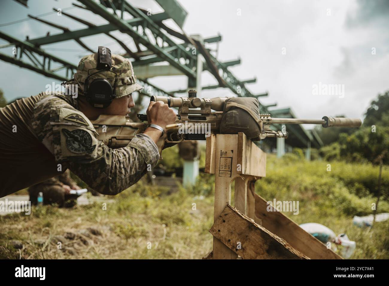 A Republic of Korea Marine fires his weapon during a sniper competition ...