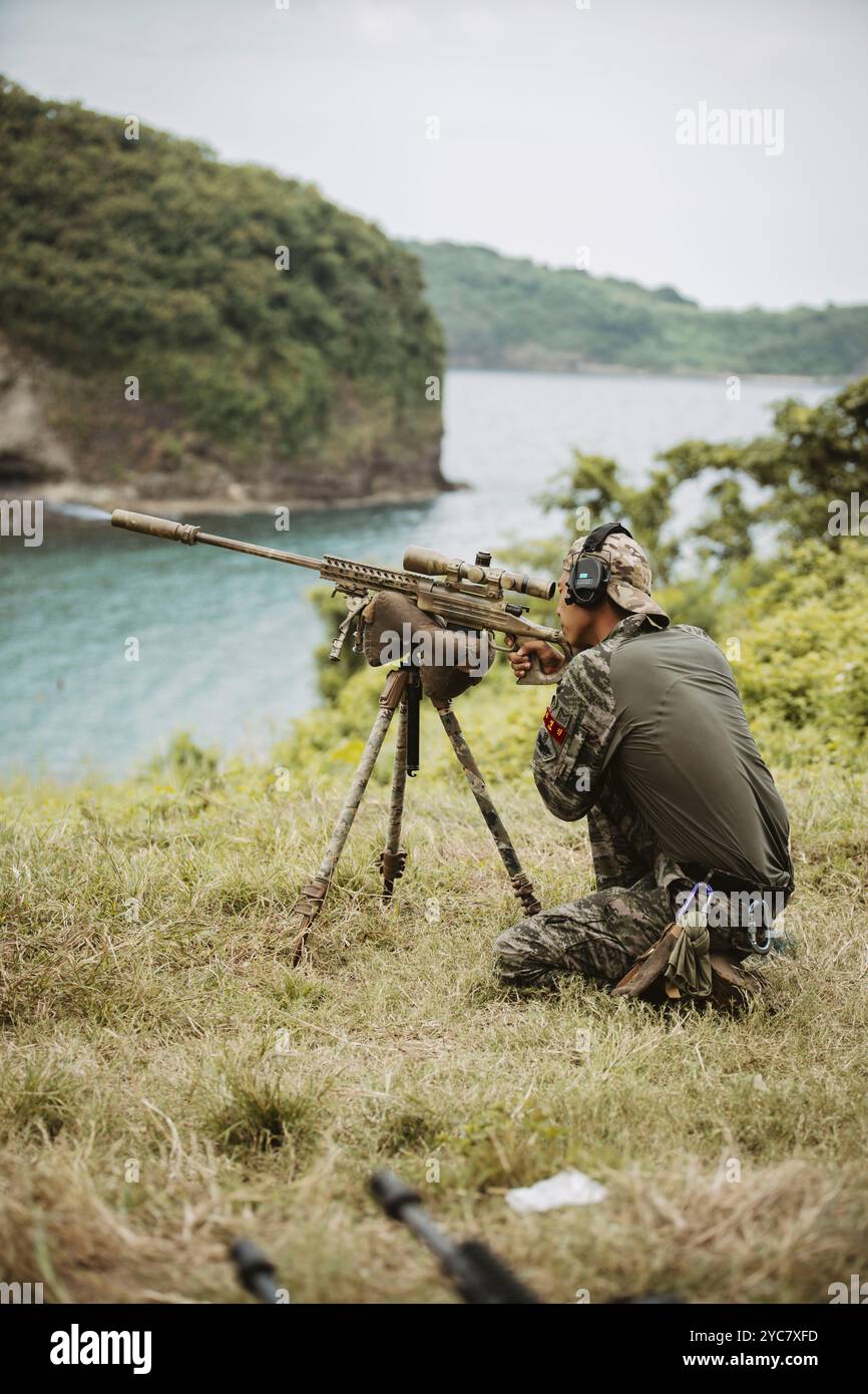 A Republic of Korea Marine fires his weapon during a sniper competition ...