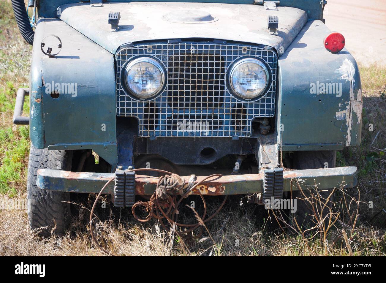 Vintage off-road vehicle close-up: rugged grille and headlights in ...