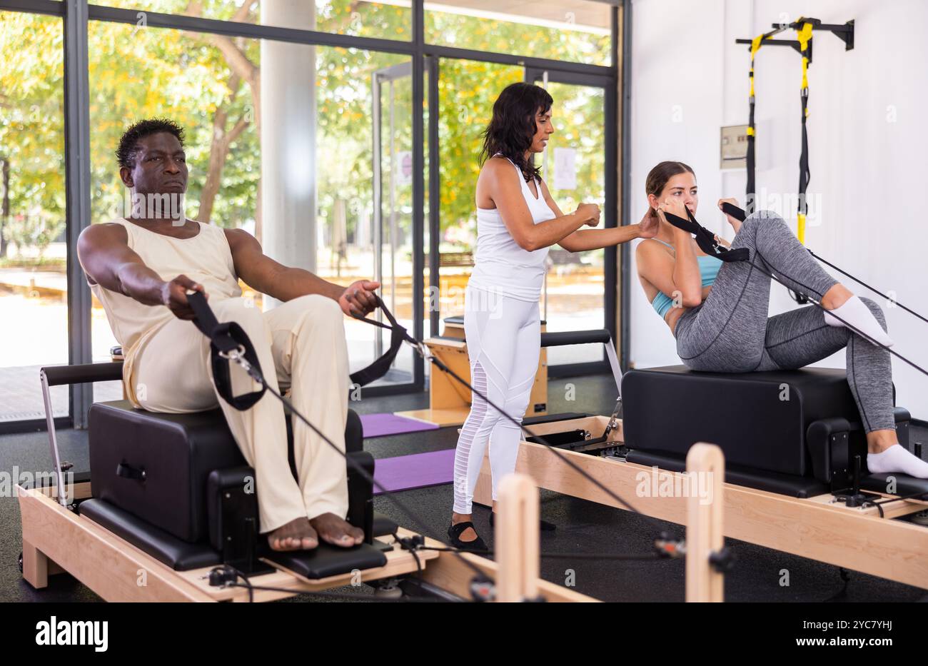Exercising on pilates reformer machines hi-res stock photography and ...