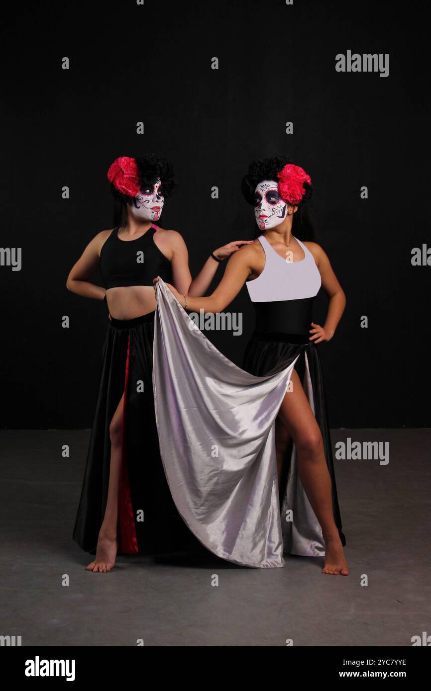 Young Mexican women with catrina makeup dance and celebrate the Day of ...