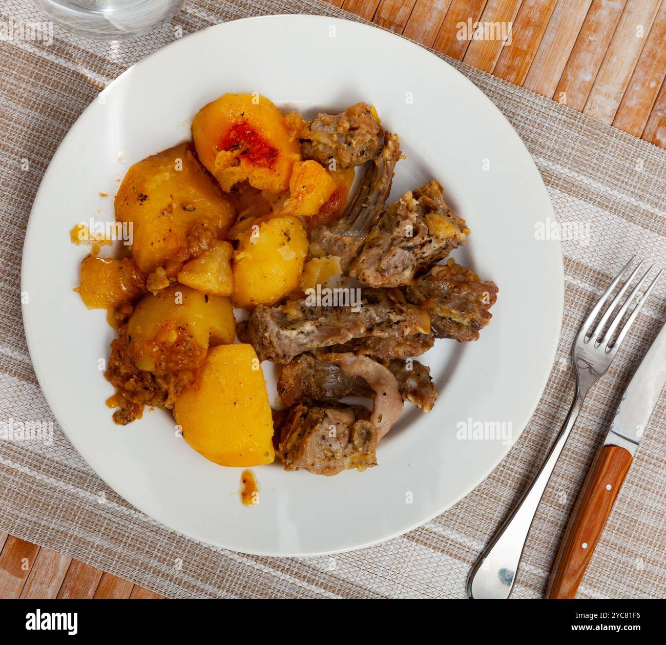 Homemade stew with rabbit pieces and potatoes Stock Photo - Alamy