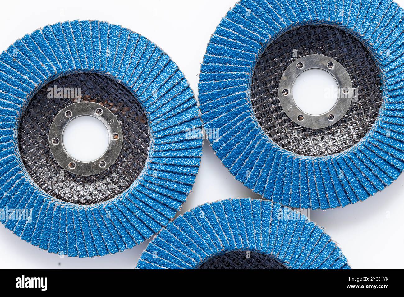 A blue abrasive grinding disc with a central metal hub and a white ...