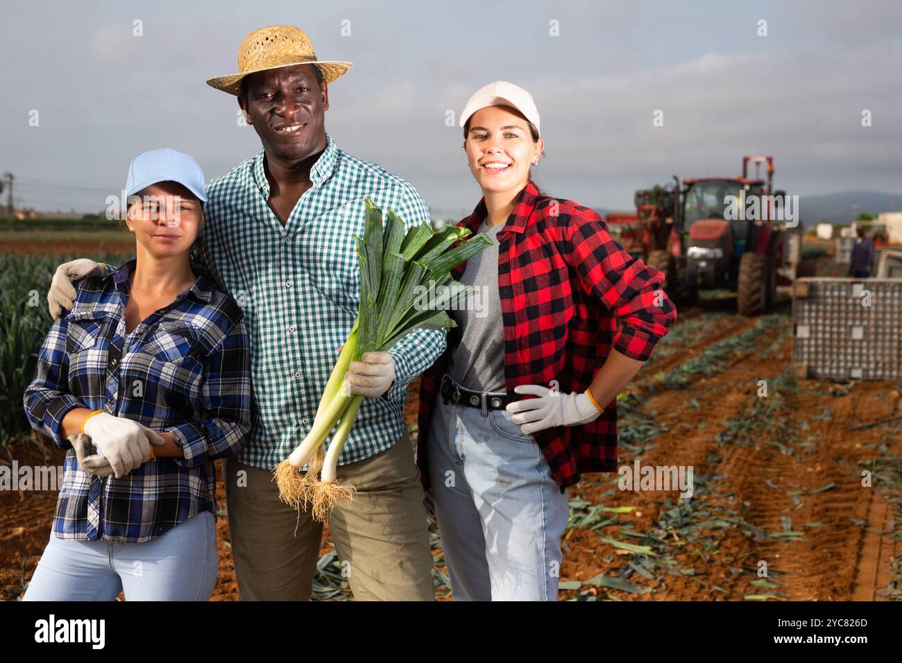 Proud farmers posing on leaf vegetables field Stock Photo - Alamy