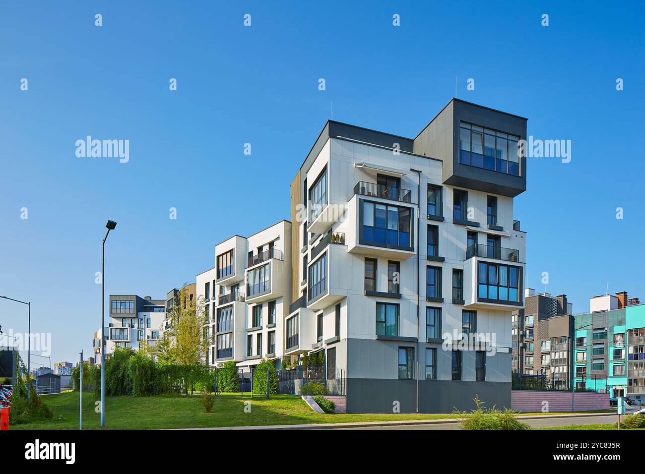 New modern block of flats in green area. residential apartment with ...