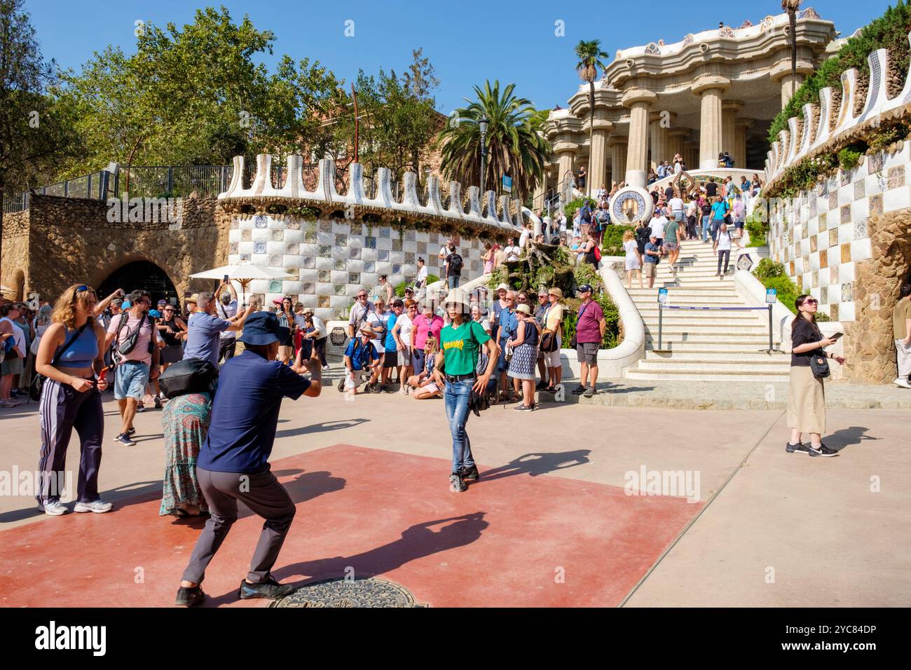 Mass tourism, overtourism, busy Parc Güell by Antoni Gaudí, escalinata ...