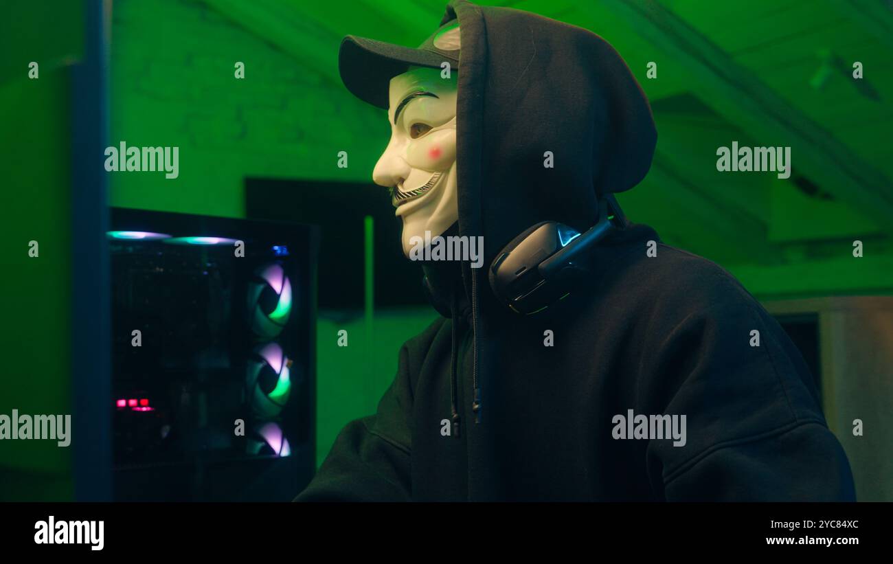 Lviv, Ukraine - June 03, 2024: Keyboard computer hacking man mask ...
