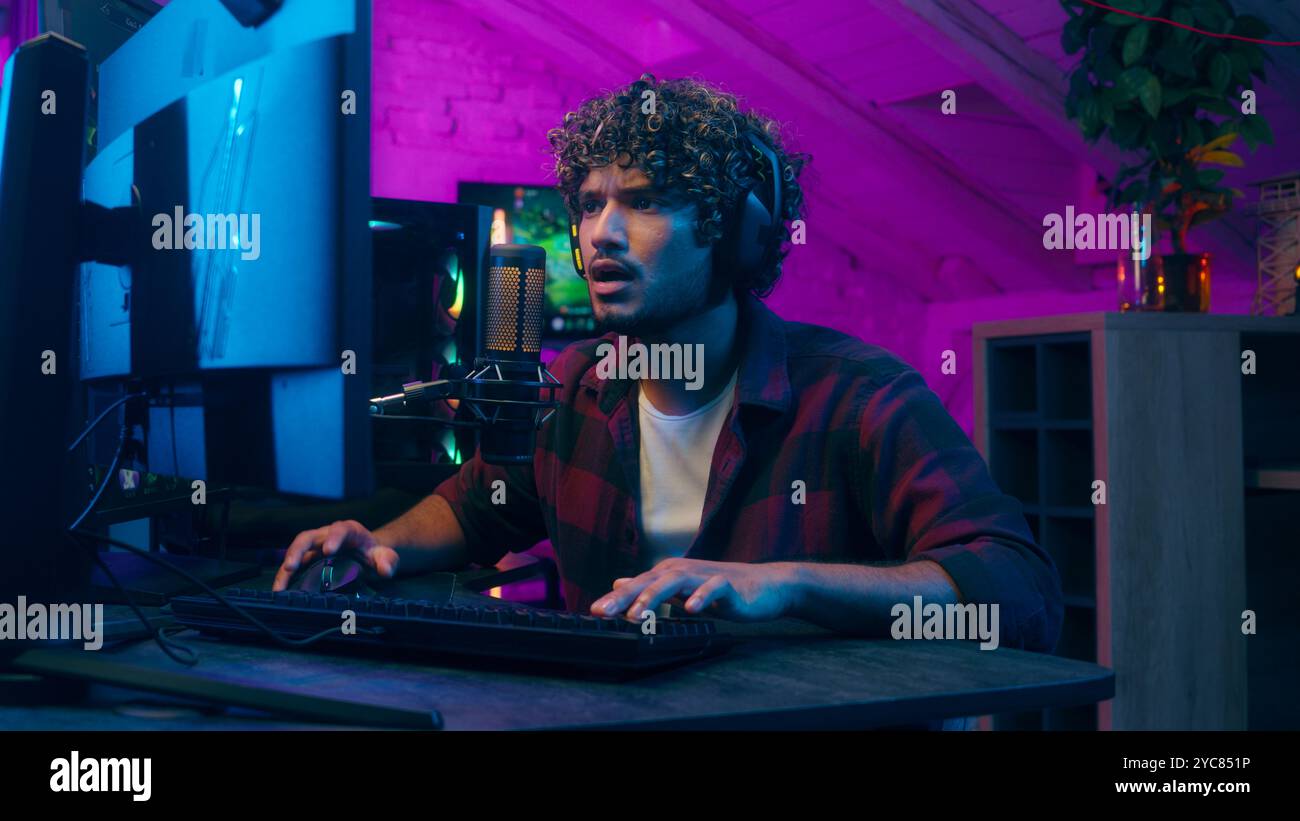 Indian Muslim Arabian man streamer playing video game addict computer ...