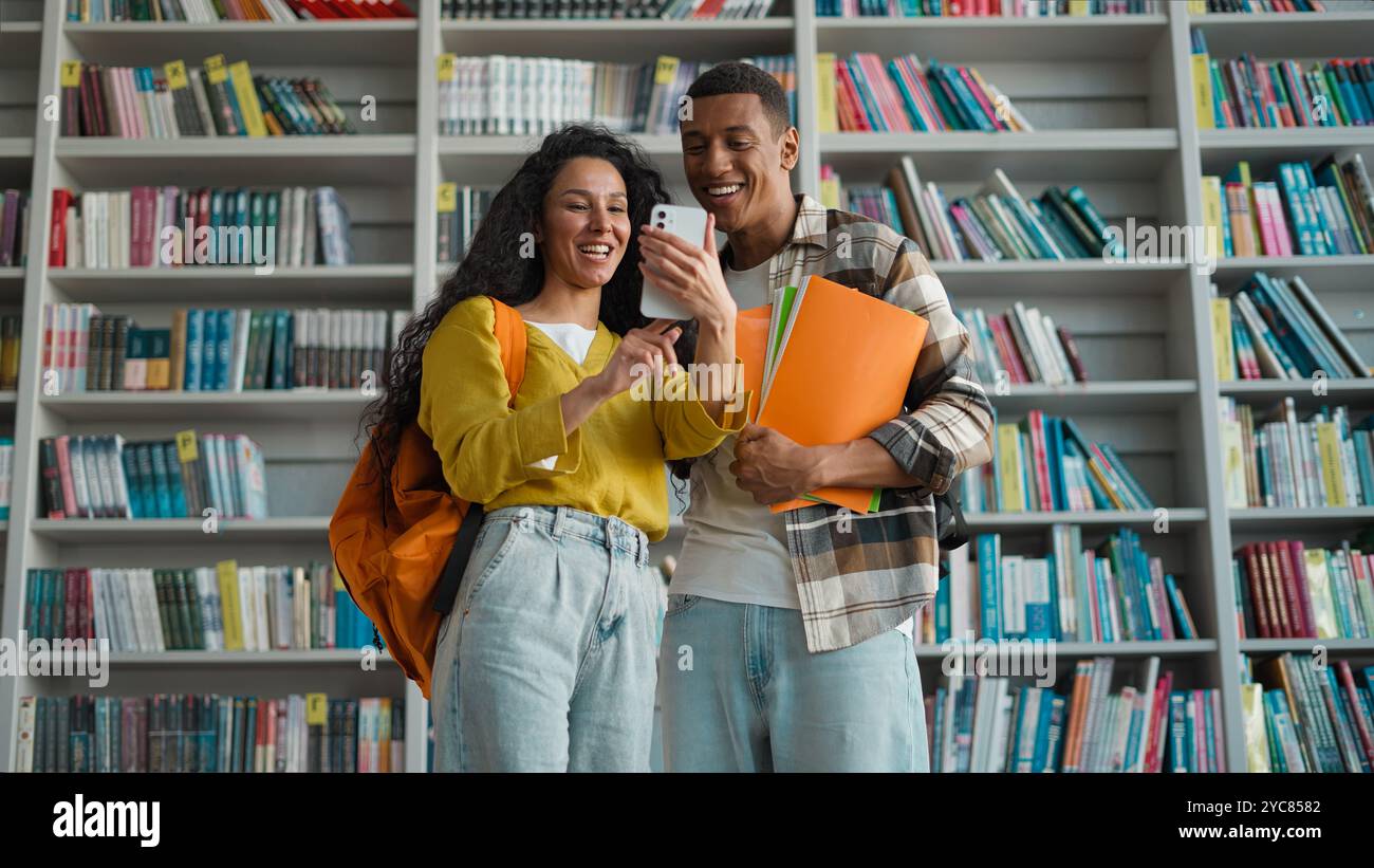 Two students classmates African American man Indian Latino Arabian ...