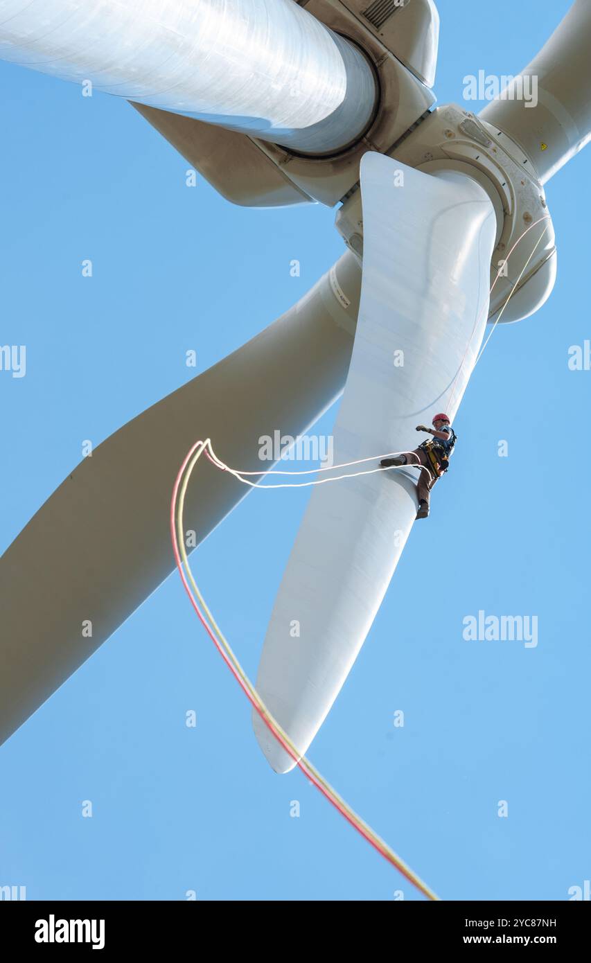 Pete Johnson of Gemini Rope Access Solutions, inspects the blades of a ...