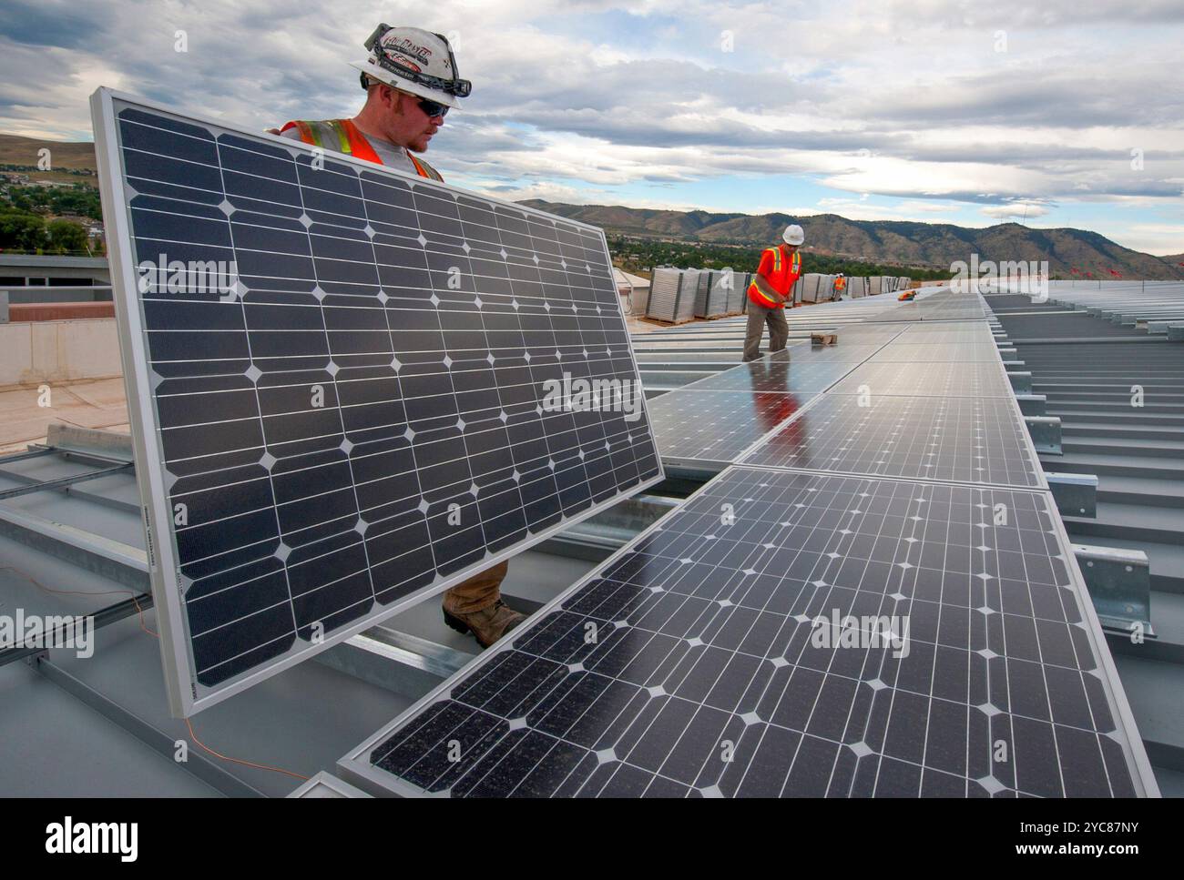 NREL Contractors Brian Lawson and Kenesaw Burwell work on panels that ...