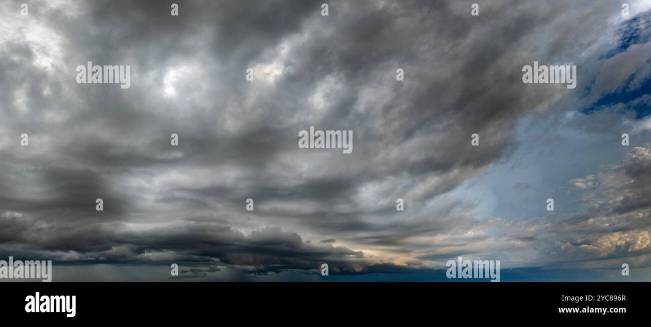 Heavy rain falling down from stormy clouds during thunderstorm on dark ...