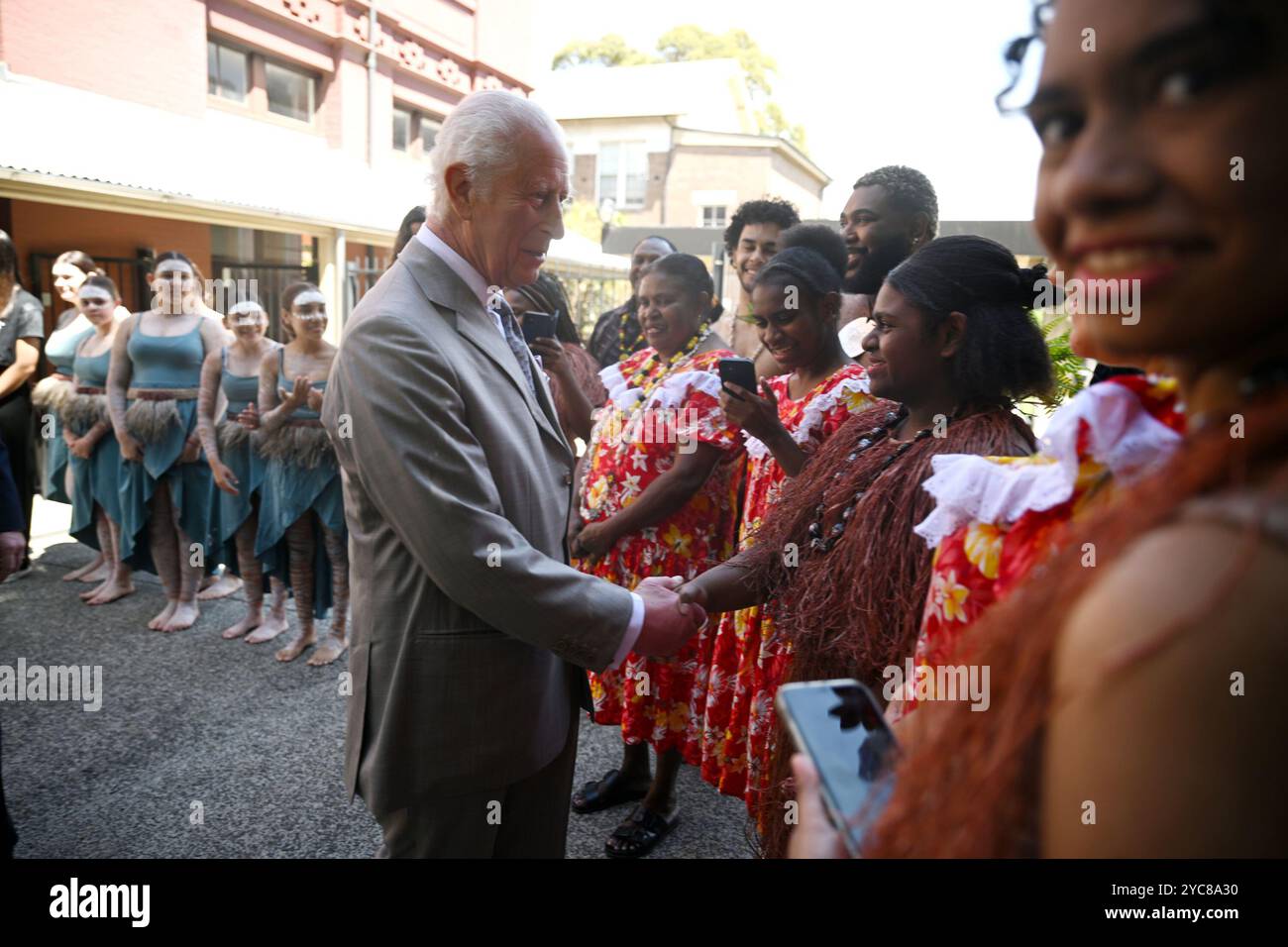 King Charles III greets an Indigenous community member, during a visit ...