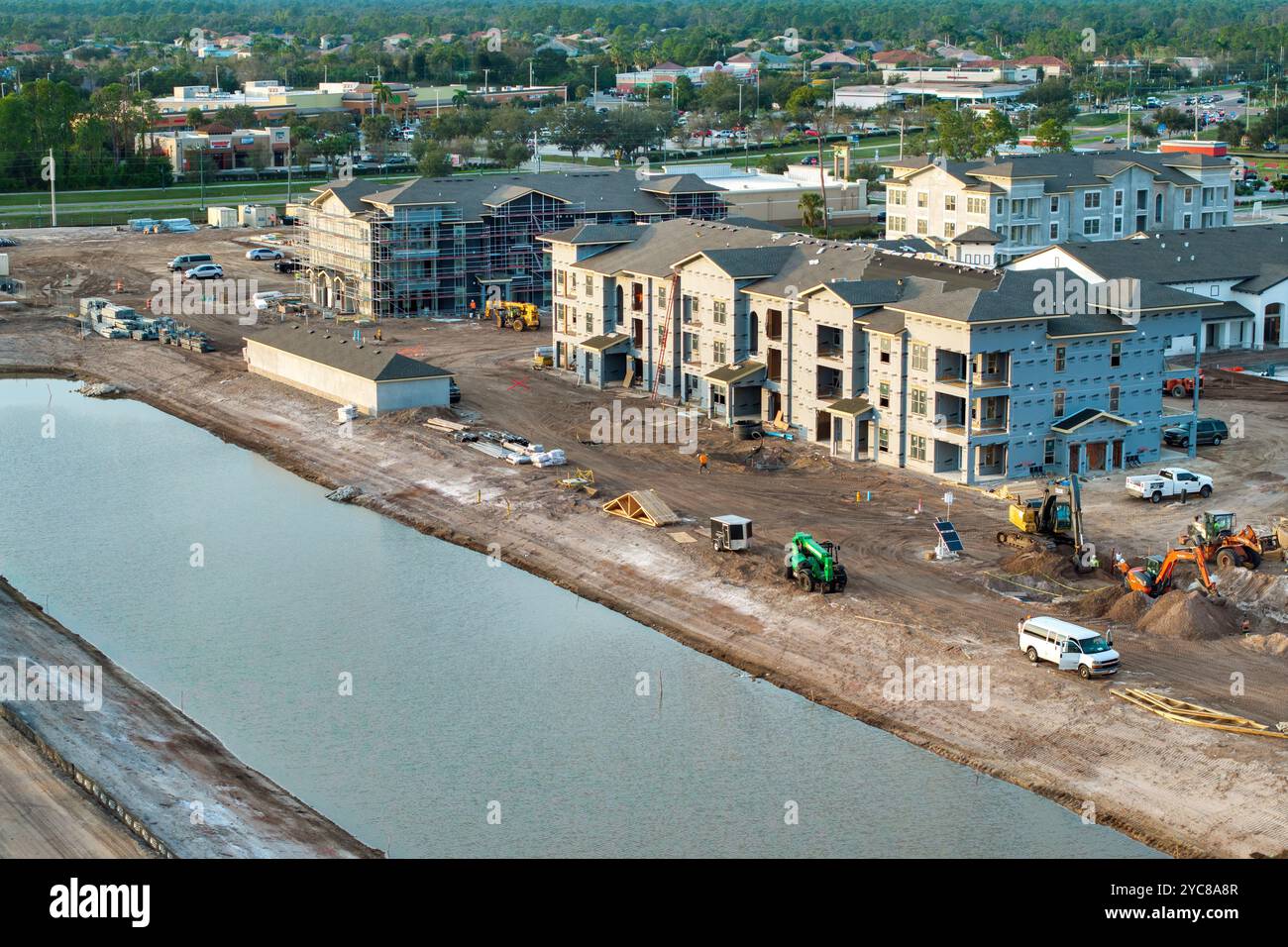 Wooden apartment buildings under construction in new developing ...