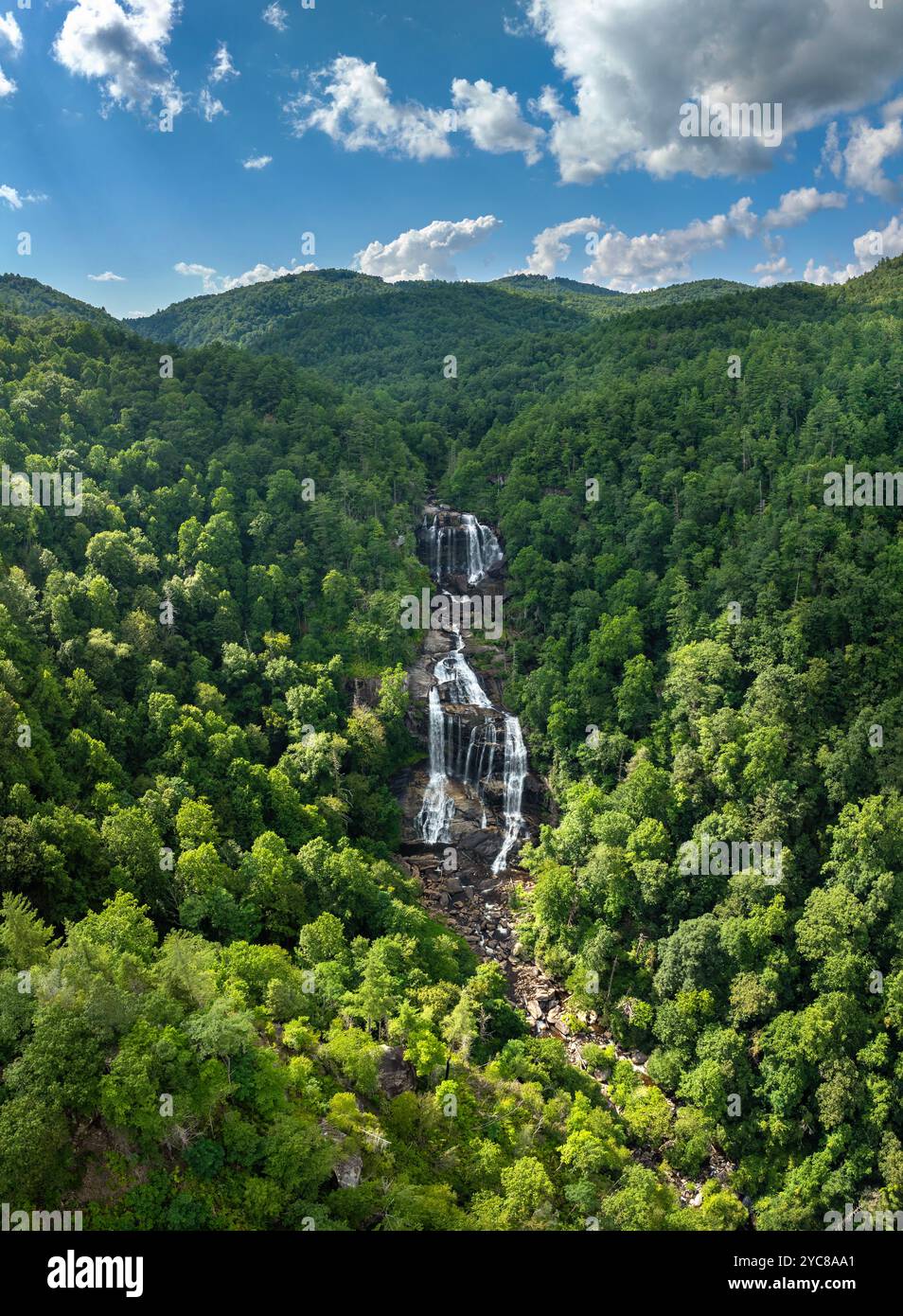 Whitewater Falls with falling down clear water from rocky boulders ...