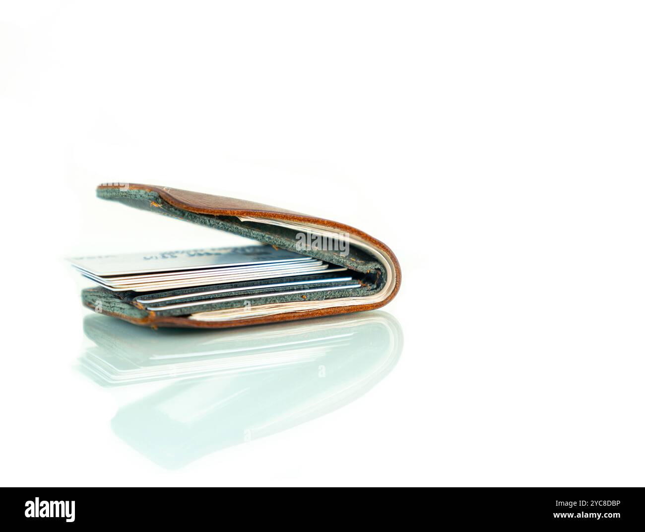 Fat wallet with bank note and credit card isolate on white background ...