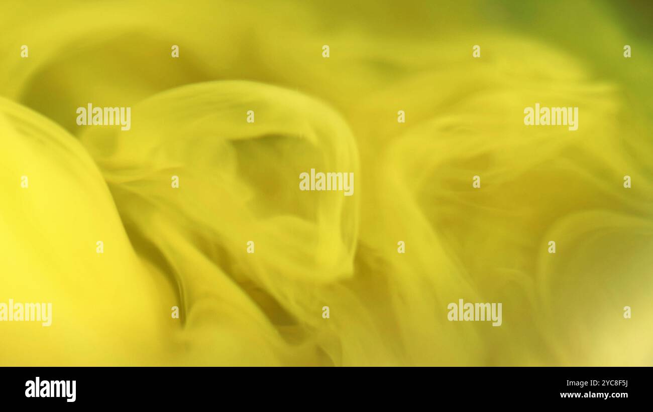 Color smoke texture. Ink water splash. Defocused bright yellow ethereal mist cloud swirl ...