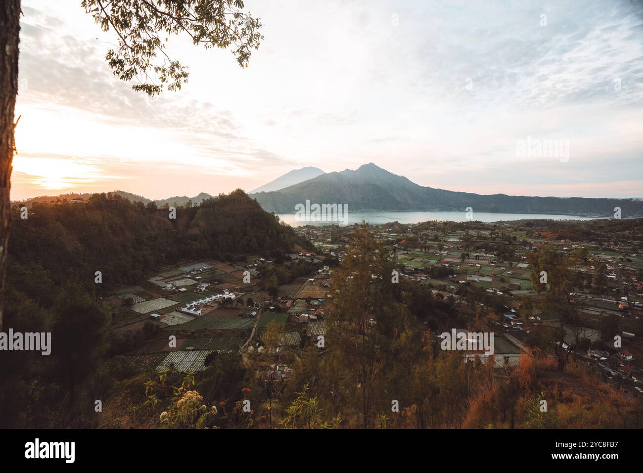Sunrise view of Trunyan and Agung in Kintamani Region of Bali ...