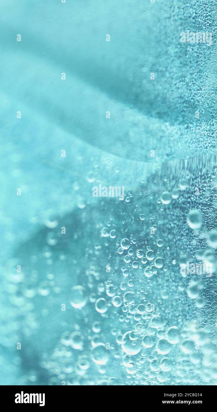 Oil water drop. Bubble liquid. Defocused clear blue color fluid swirl ...