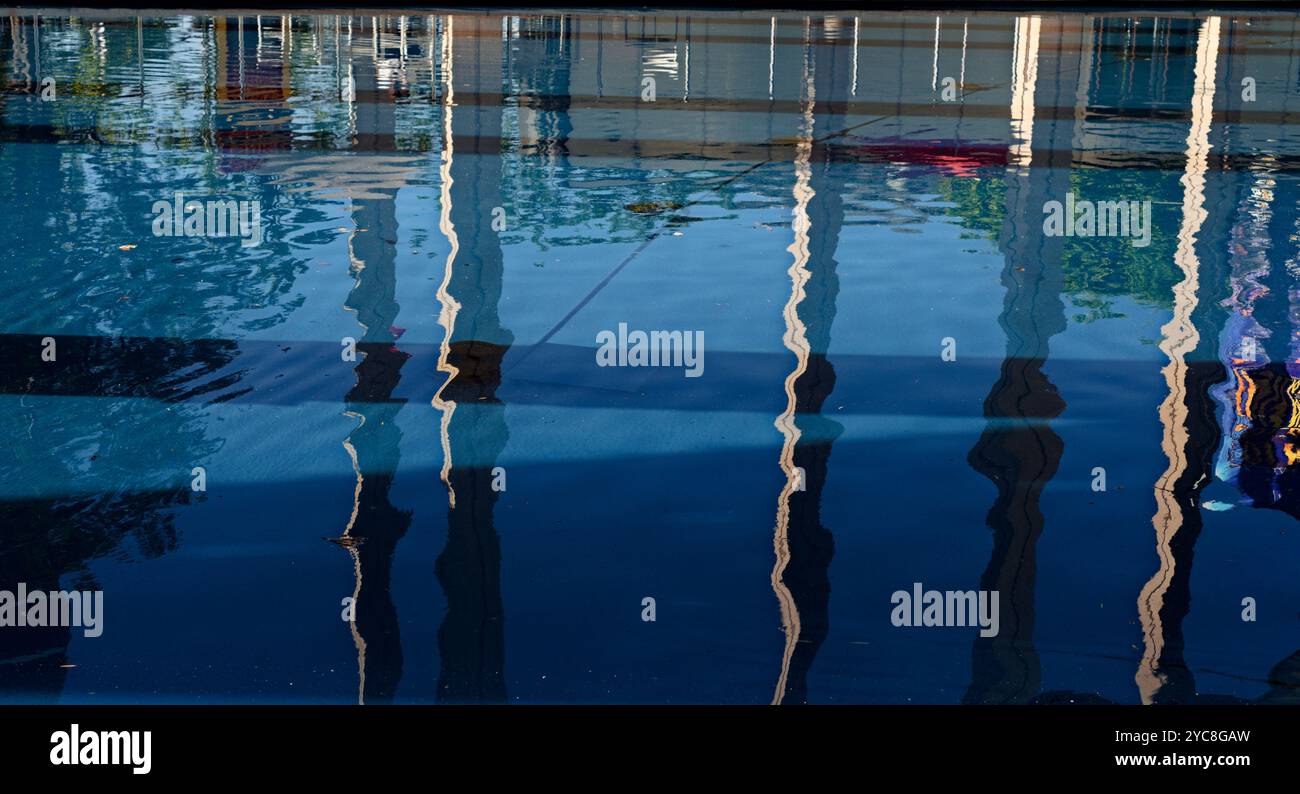 Abstract of columns & structure reflected in water creating movement in ...