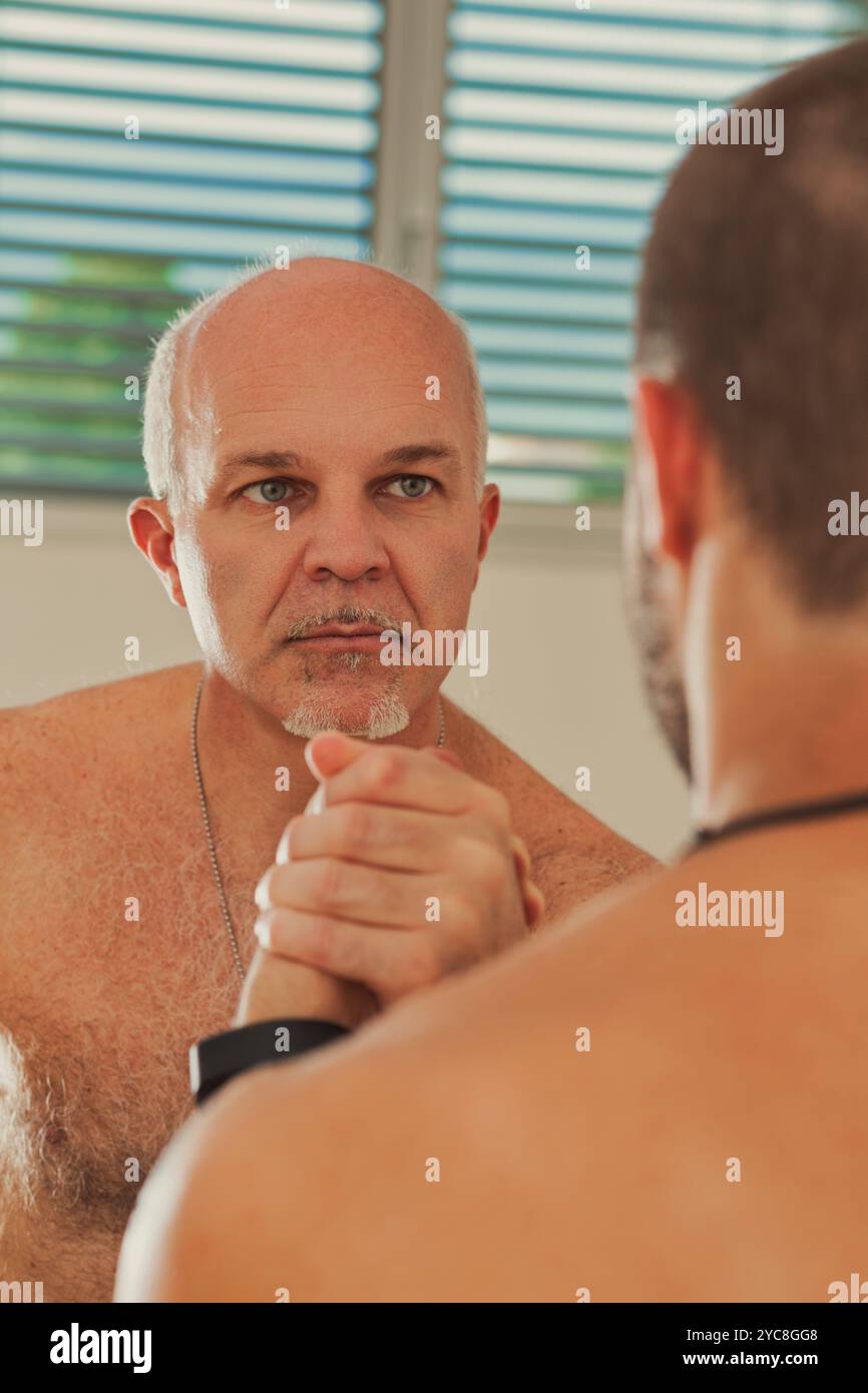 Two martial artists are practicing a grappling technique, focusing on ...