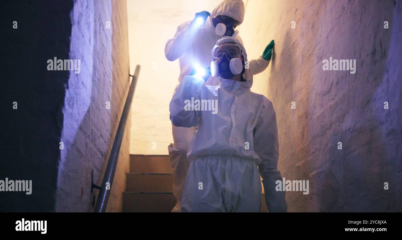 Hazmat, suit and people for disinfection walking with flashlight on ...