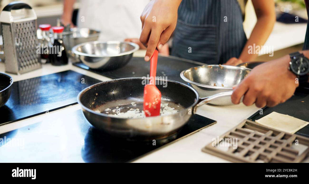 Hands, cooking and stirring in kitchen, chef and group in hospitality ...