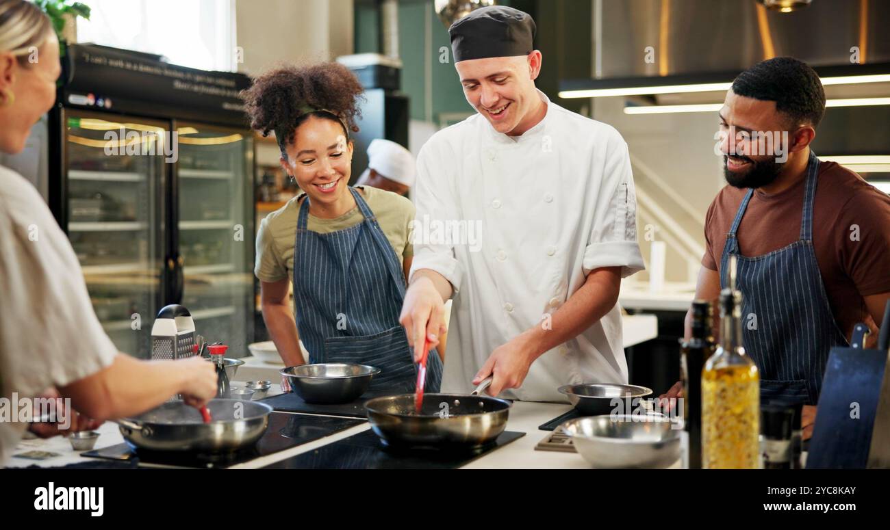 Cooking, class and chef in kitchen with group for meal preparation ...