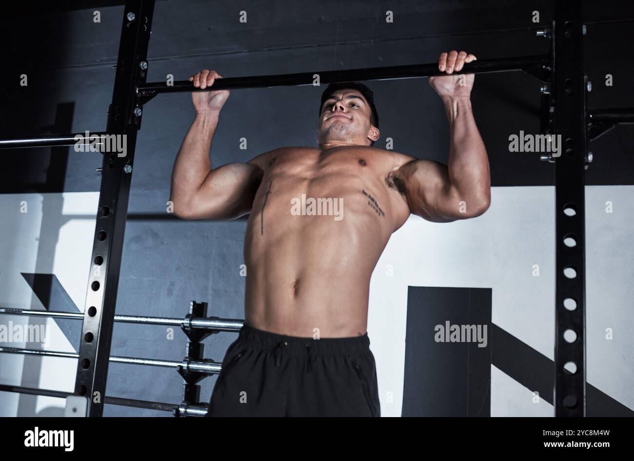 Training, pull up and health with man in gym for muscle, power and ...
