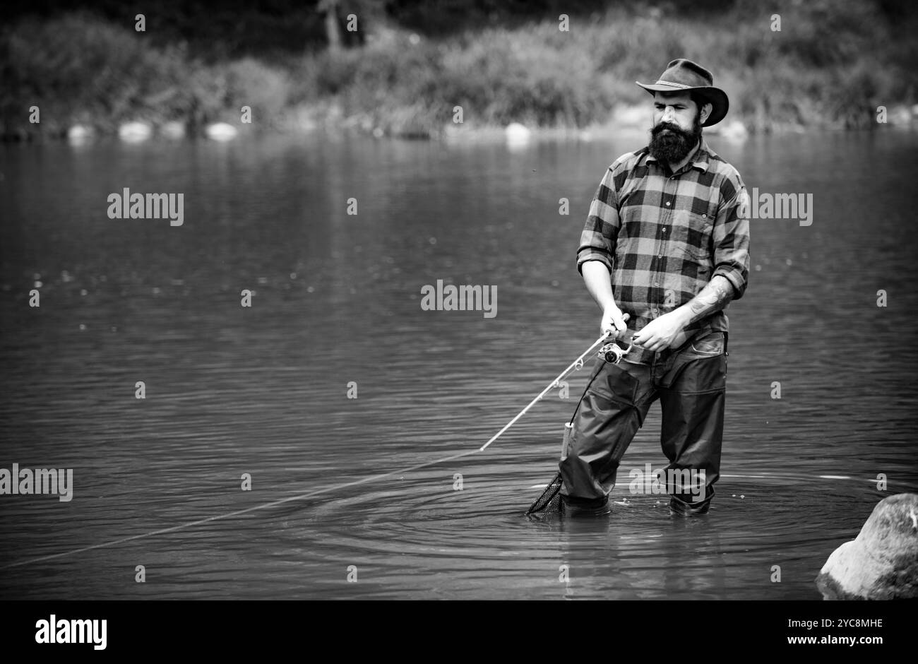 Elderly fisherman fishing rod Black and White Stock Photos & Images - Alamy