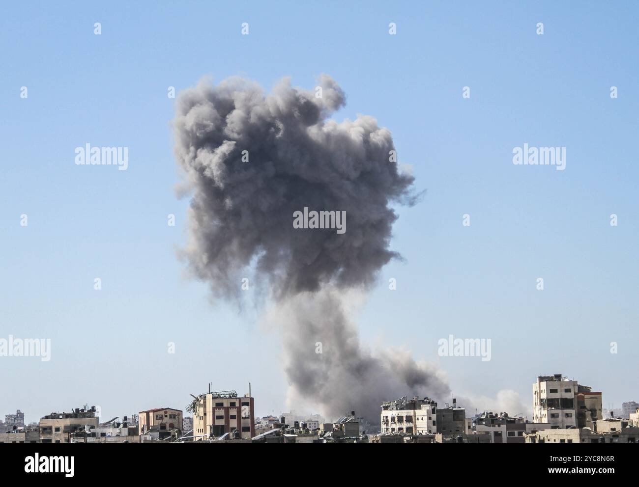 Gaza, Palestine. 20th Oct, 2024. Columns of smoke rise after heavy ...