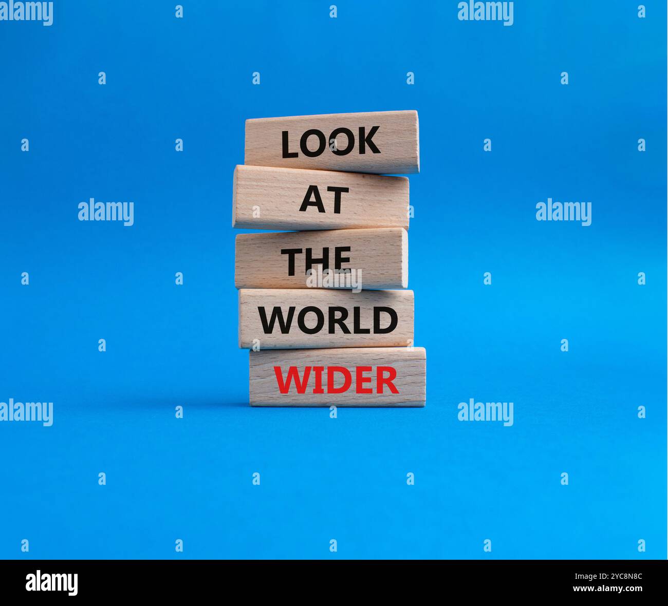 Look at the world wider symbol. Wooden blocks with words Look at the ...
