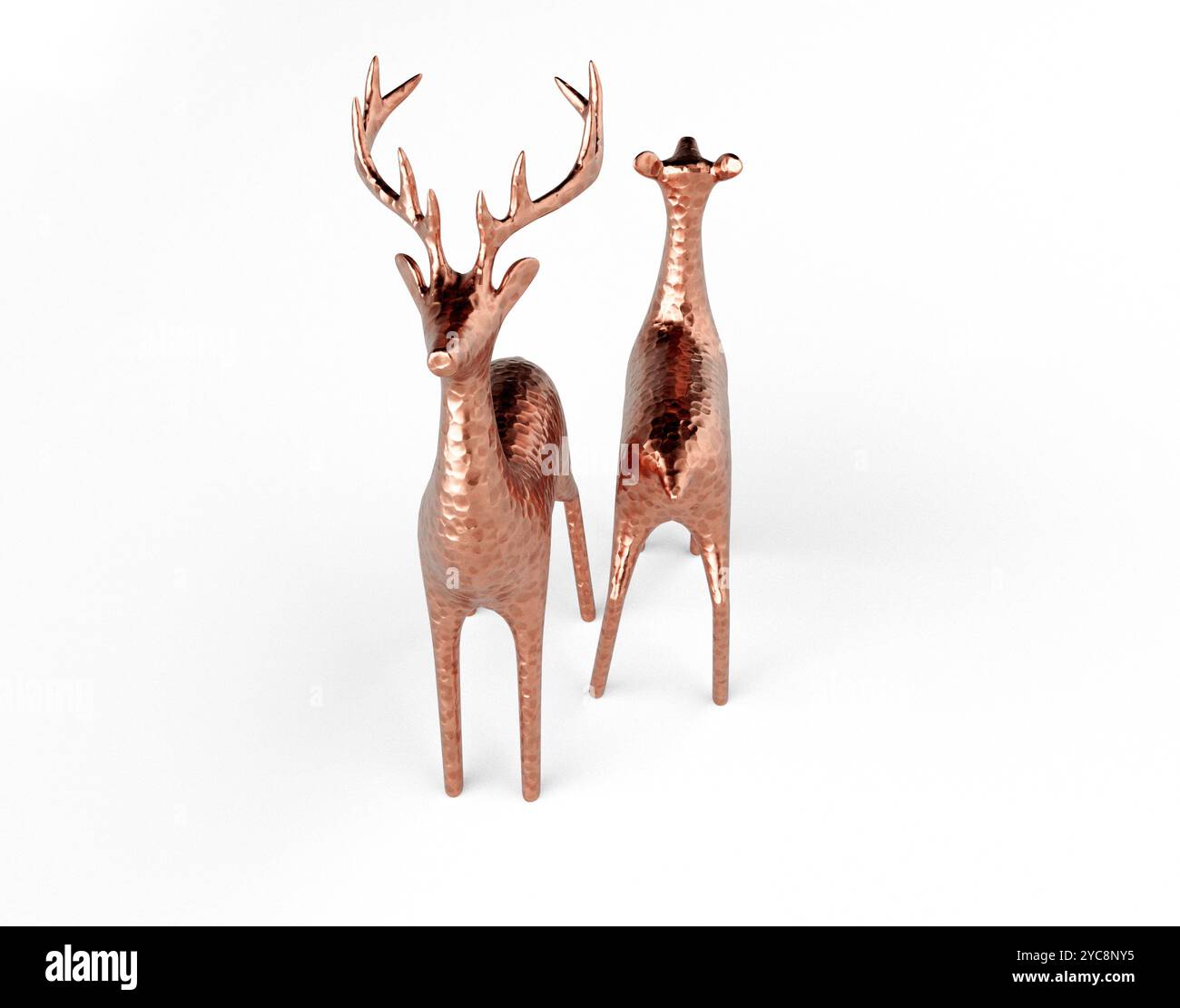 Two copper statues of a doe and deer reindeer on an isolated background ...