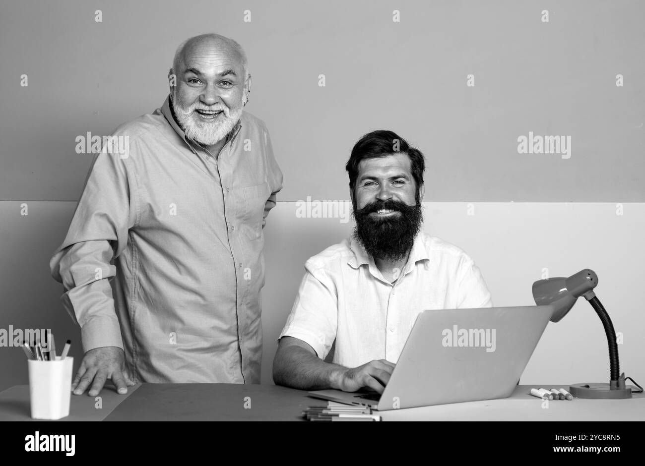 Two smiling colleagues in business Black and White Stock Photos ...
