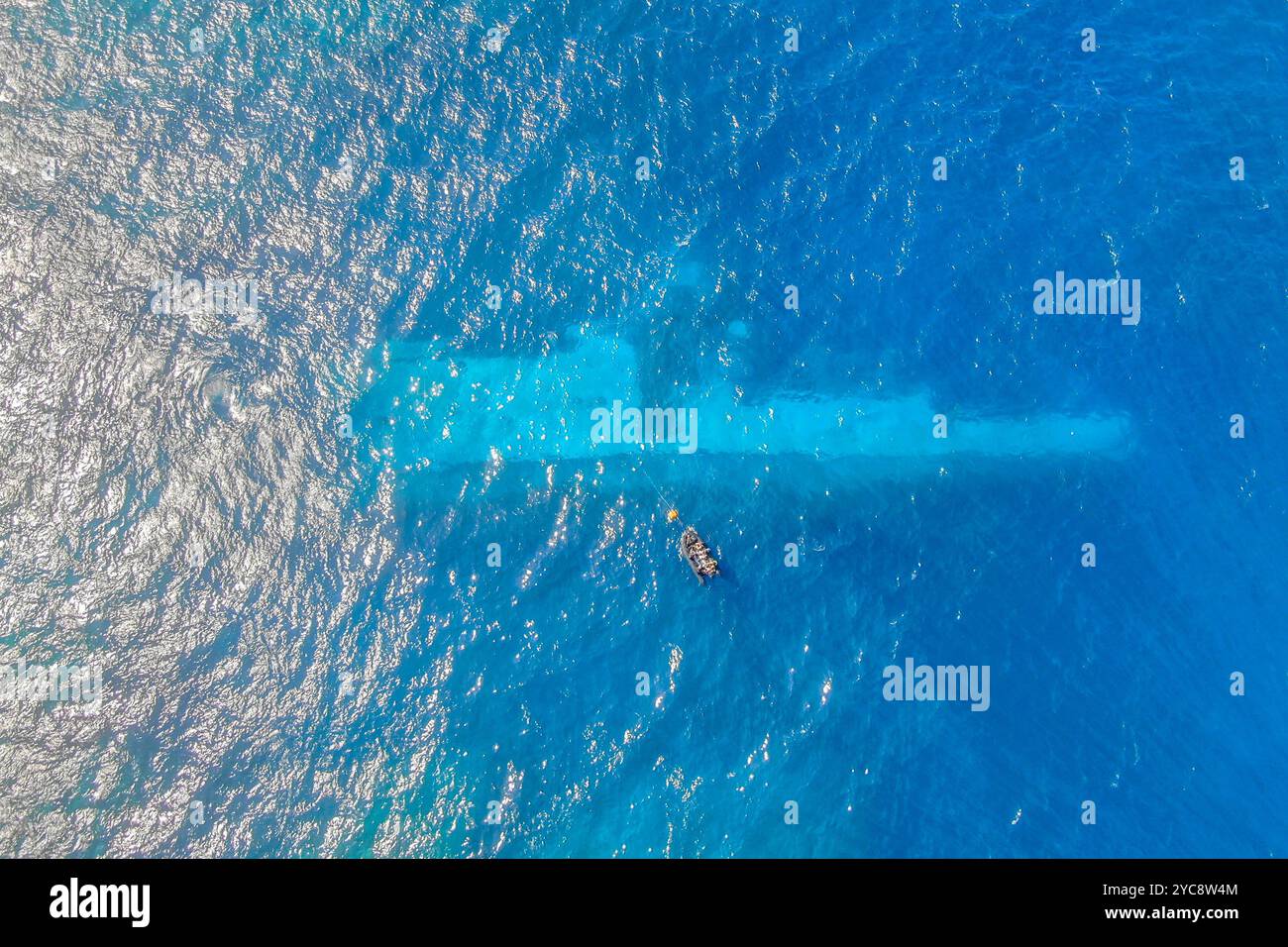 In this photo provided by the New Zealand Defence Force, divers survey ...