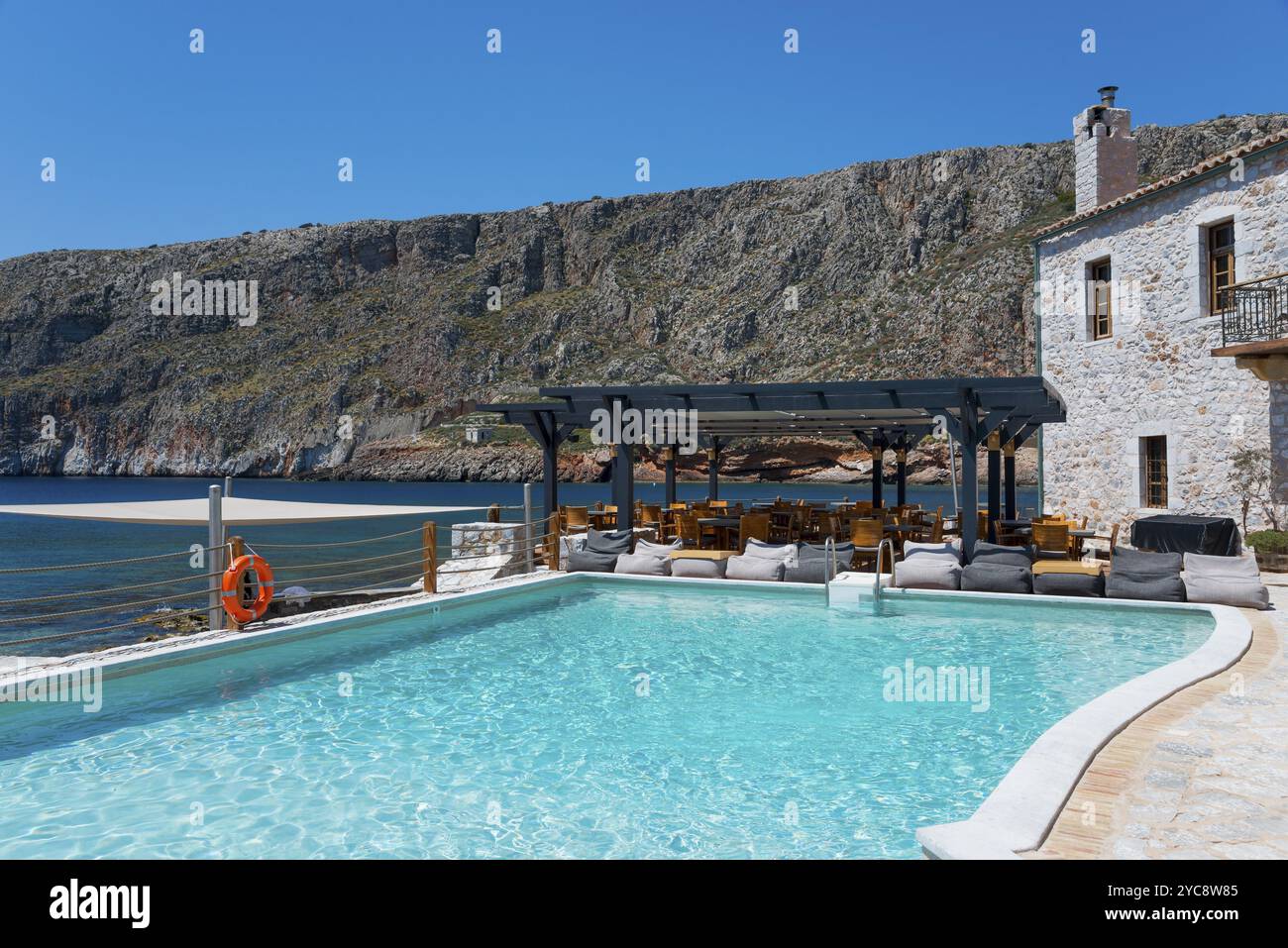 Luxurious swimming pool with sea and mountain views in glorious weather ...